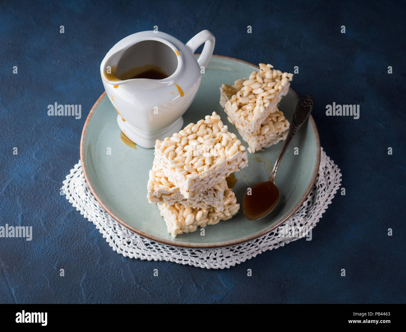 Sweet puffed rice marshmallow bars served with salted caramel Stock ...