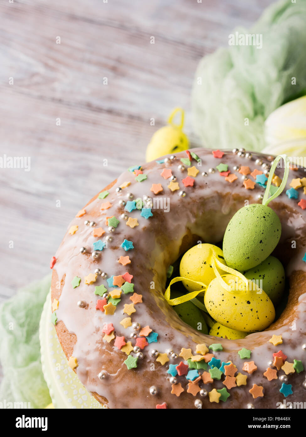 Easter ring cake with decorative festive eggs and sprinkles Stock Photo ...