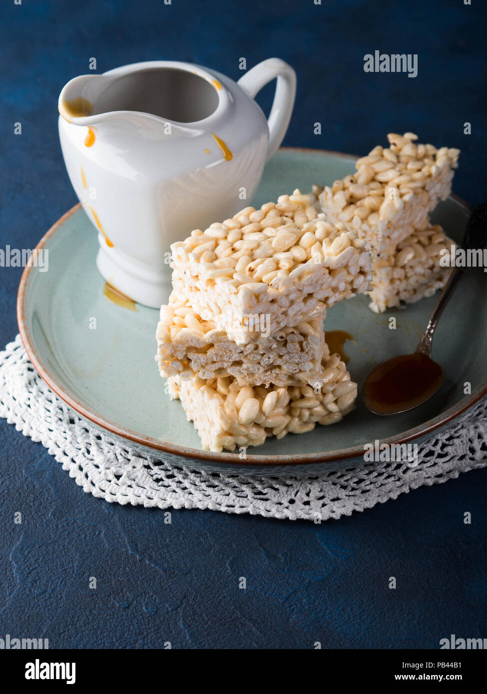 Sweet puffed rice marshmallow bars served with salted caramel Stock ...