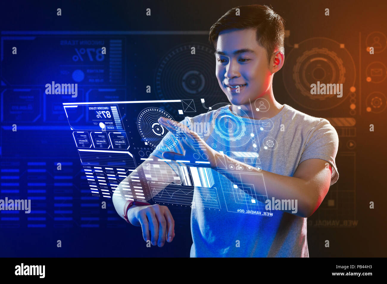 Emotional web developer smiling and looking at the transparent ...