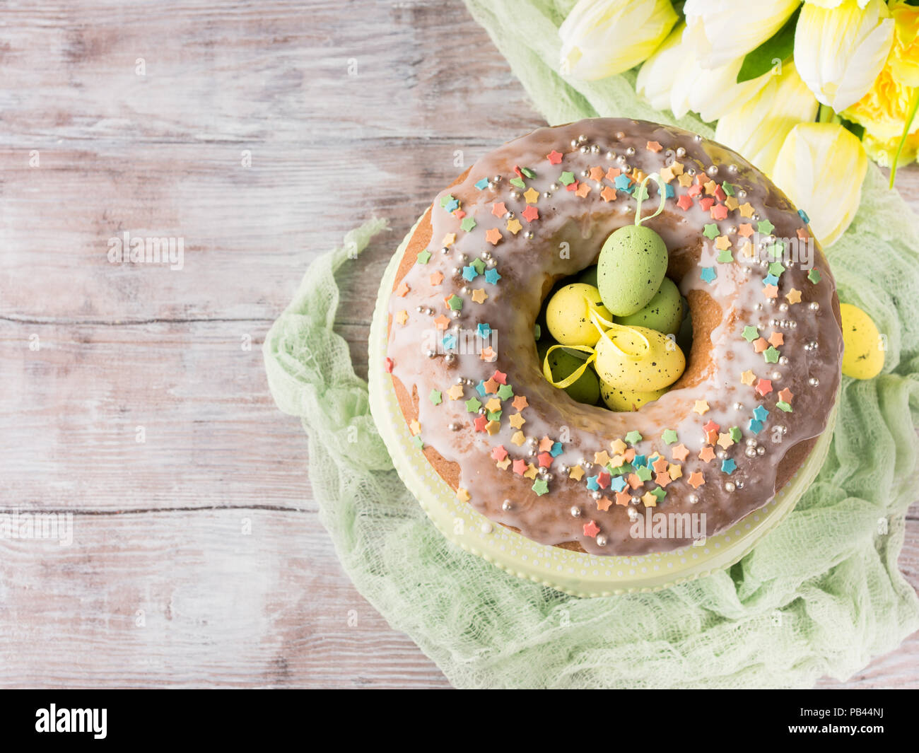 Easter ring cake with decorative festive eggs and sprinkles Stock Photo ...