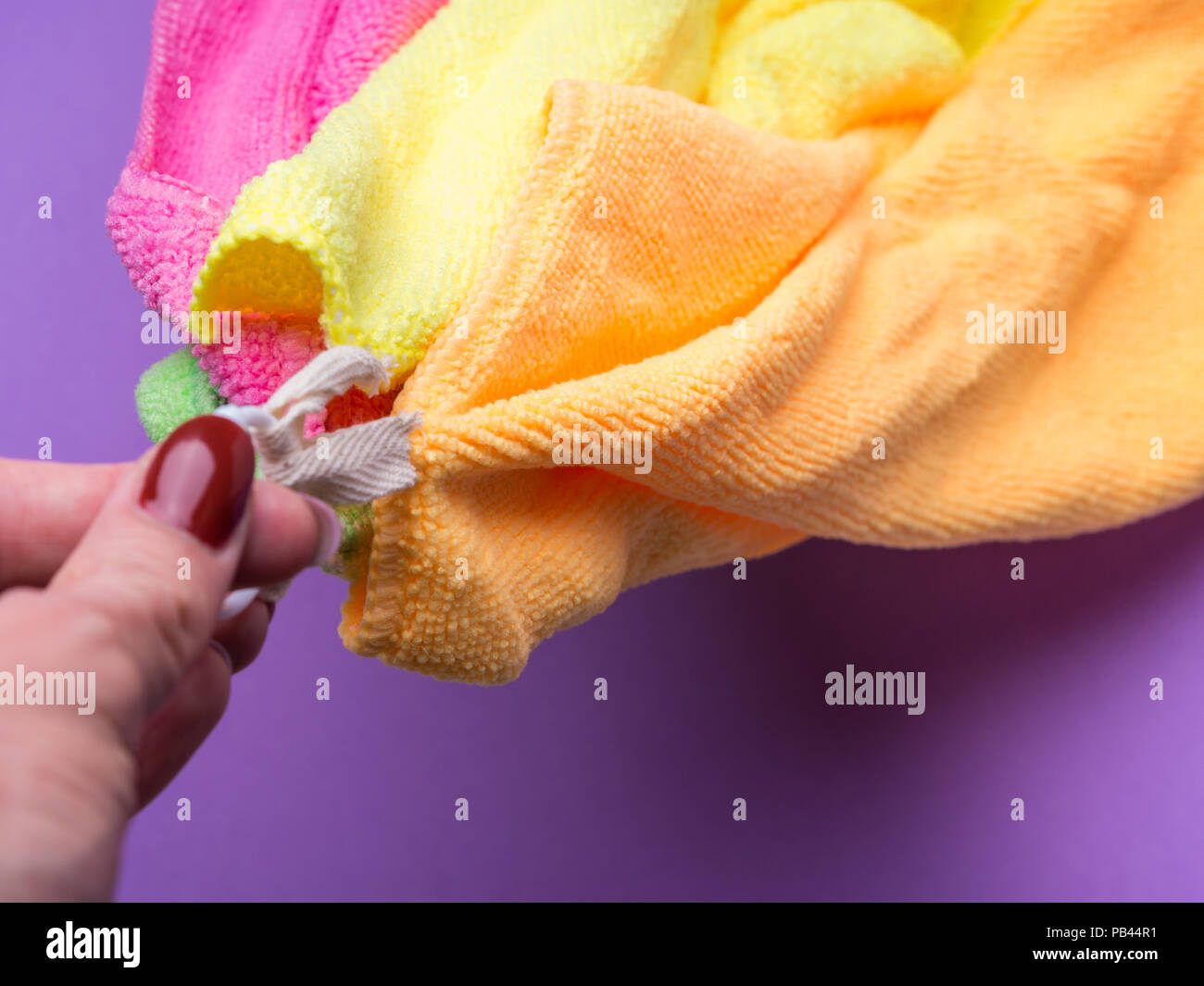 Woman hand holding set of microfiber cloths Stock Photo - Alamy