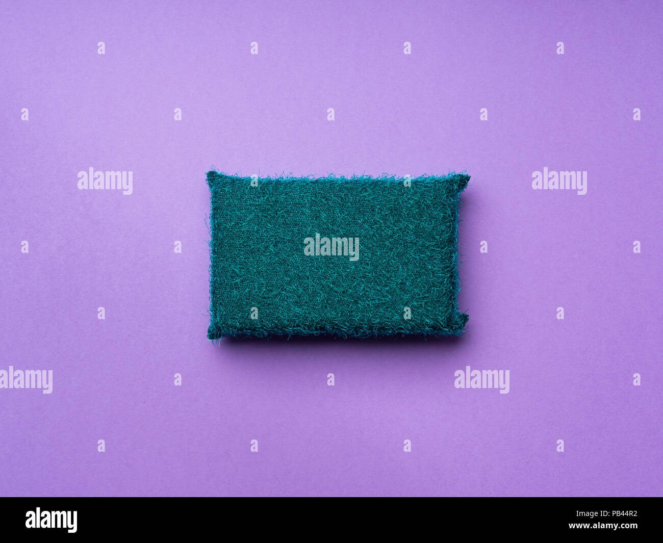 Cleaning sponge on purple background. Minimal cleaning concept Stock ...