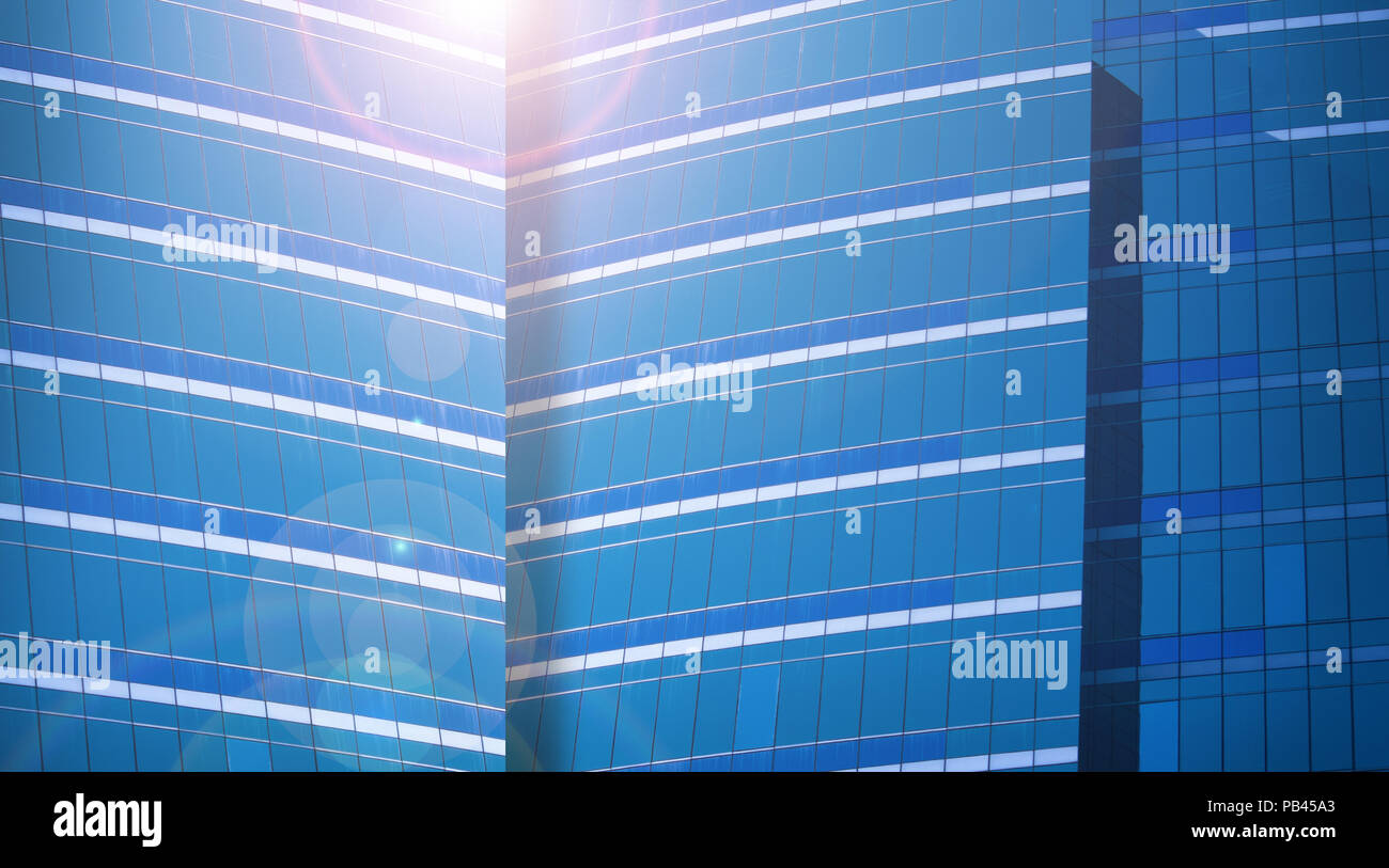 Close up of a modern business building and lens flare in blue color ...