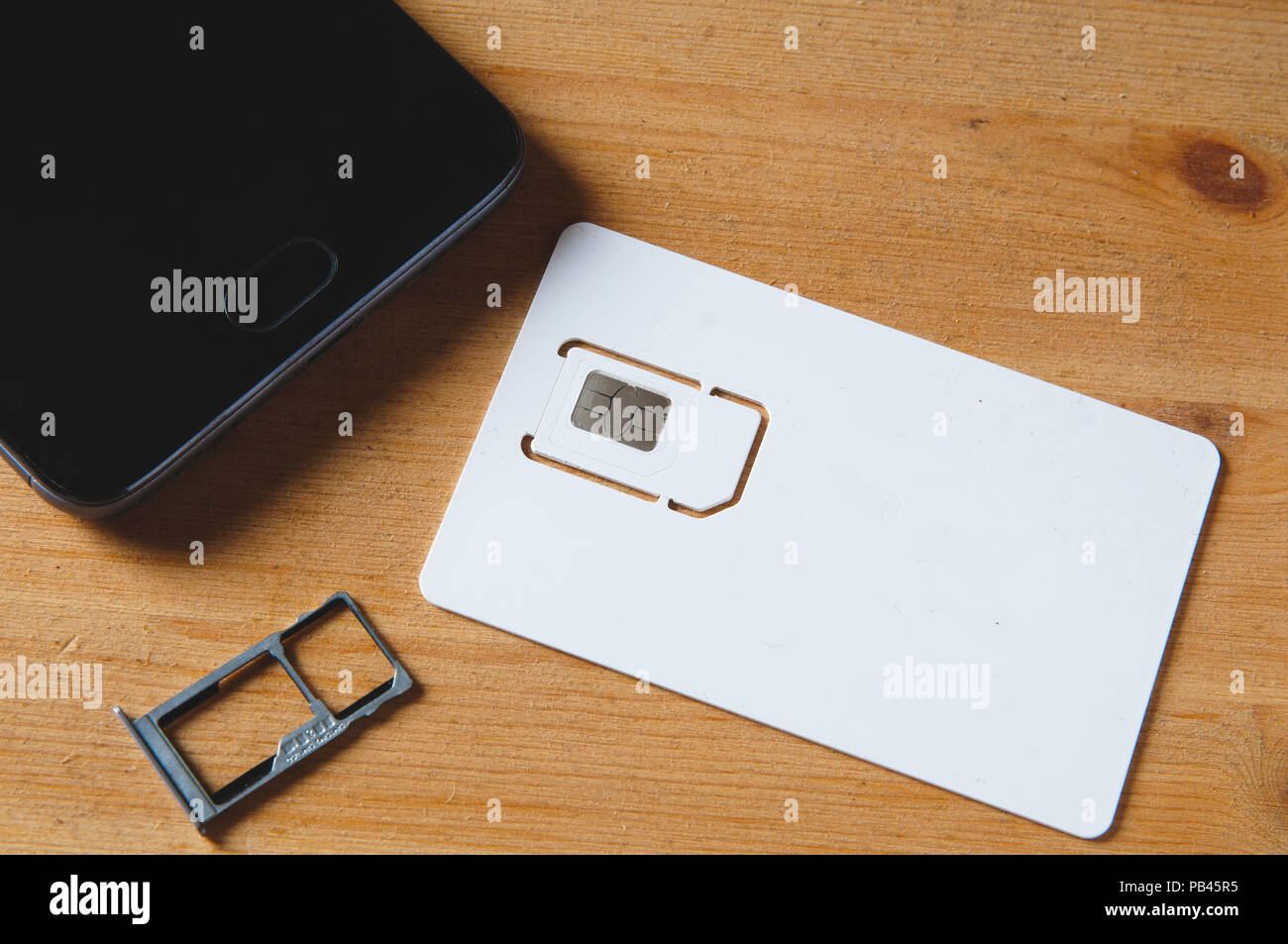 Unbranded sim card ready to be plugged in a smartphone, sim card ...