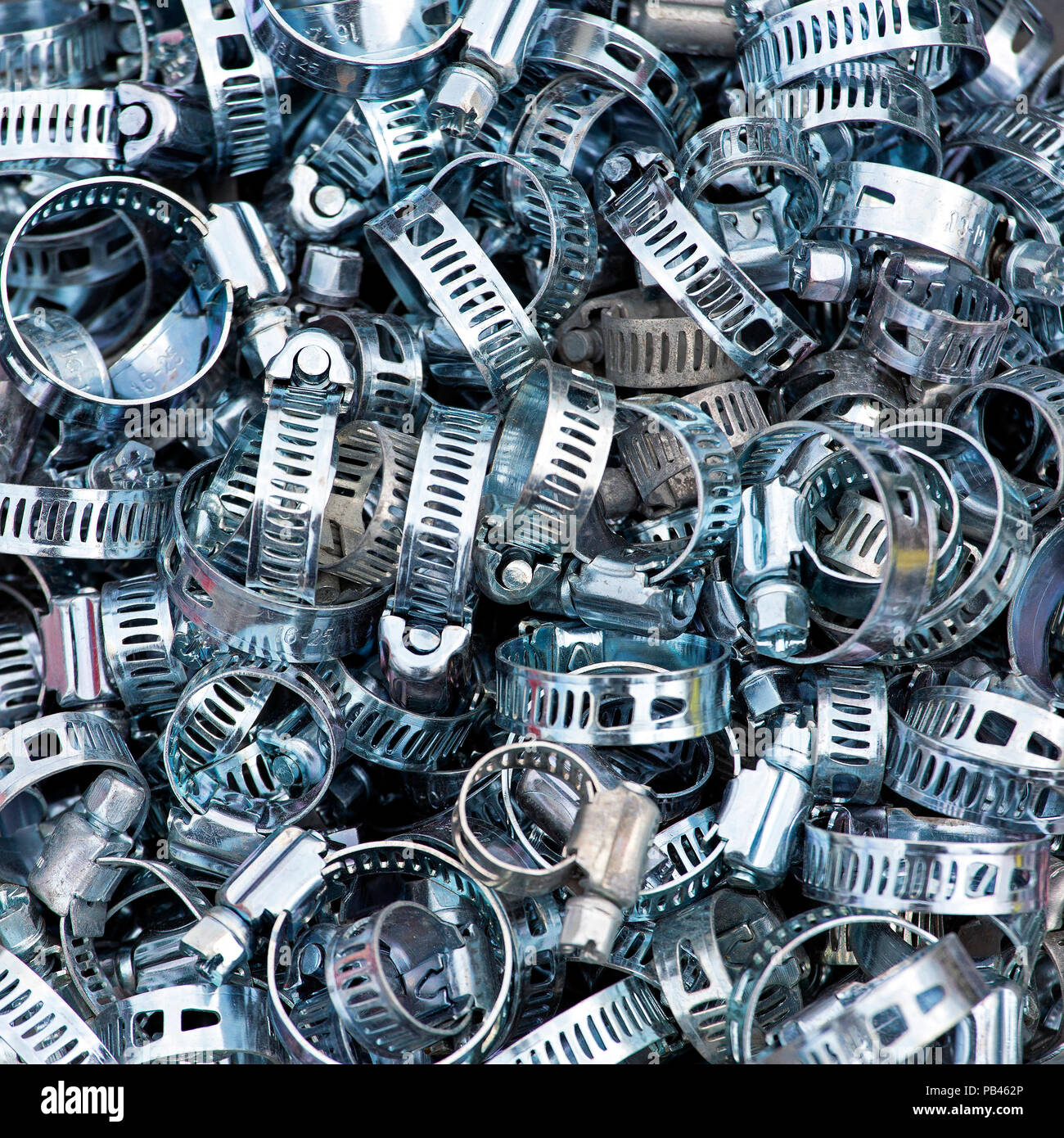 Big pile of bolt band clamps parts Stock Photo - Alamy