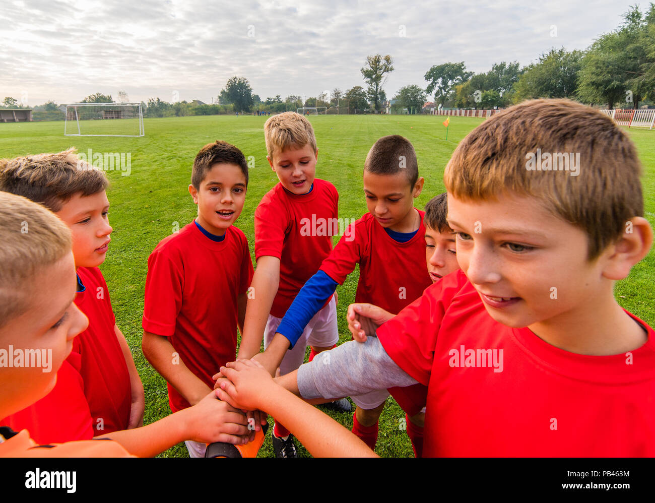 Boys celebrating after football match Stock Photo - Alamy