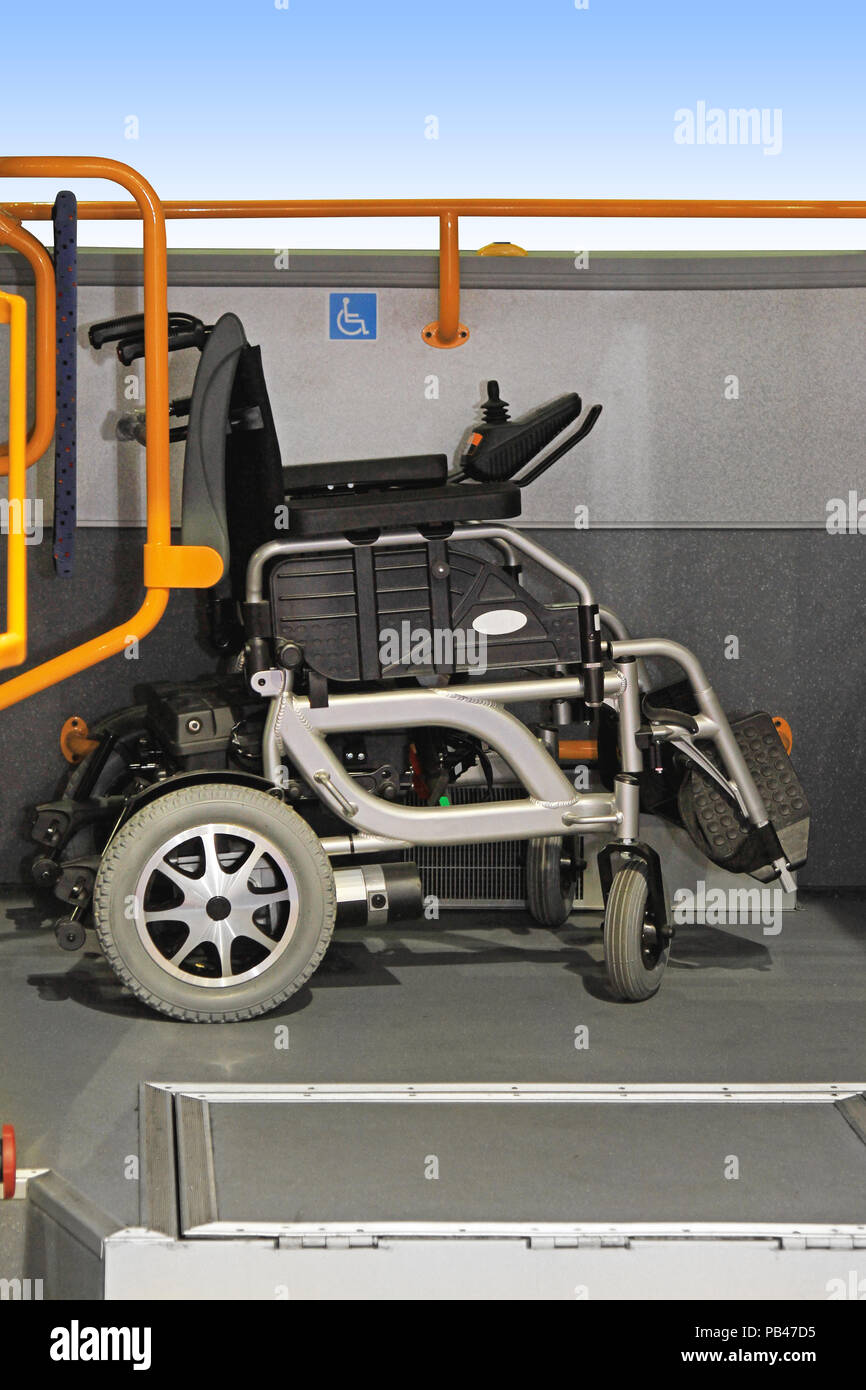 Electric wheelchair at allocated space in public bus Stock Photo - Alamy