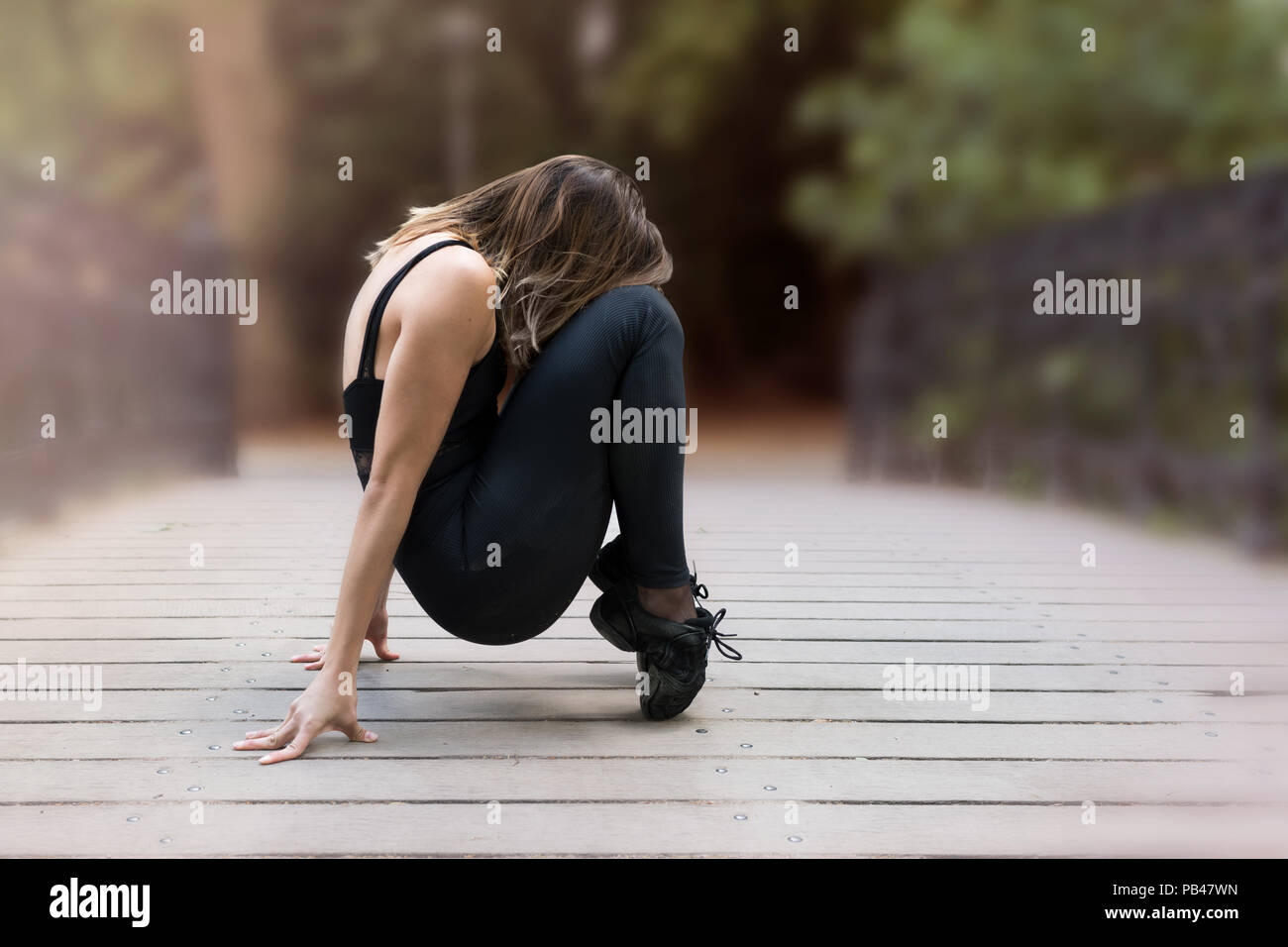Young Woman Balancing On Toes Stock Photo - Alamy