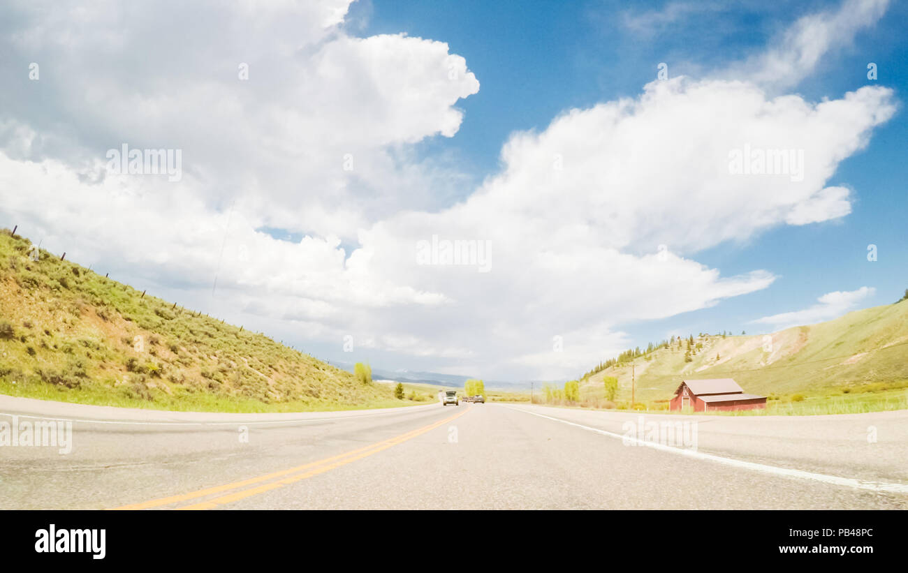 Driving on paved road in the mountains Stock Photo - Alamy