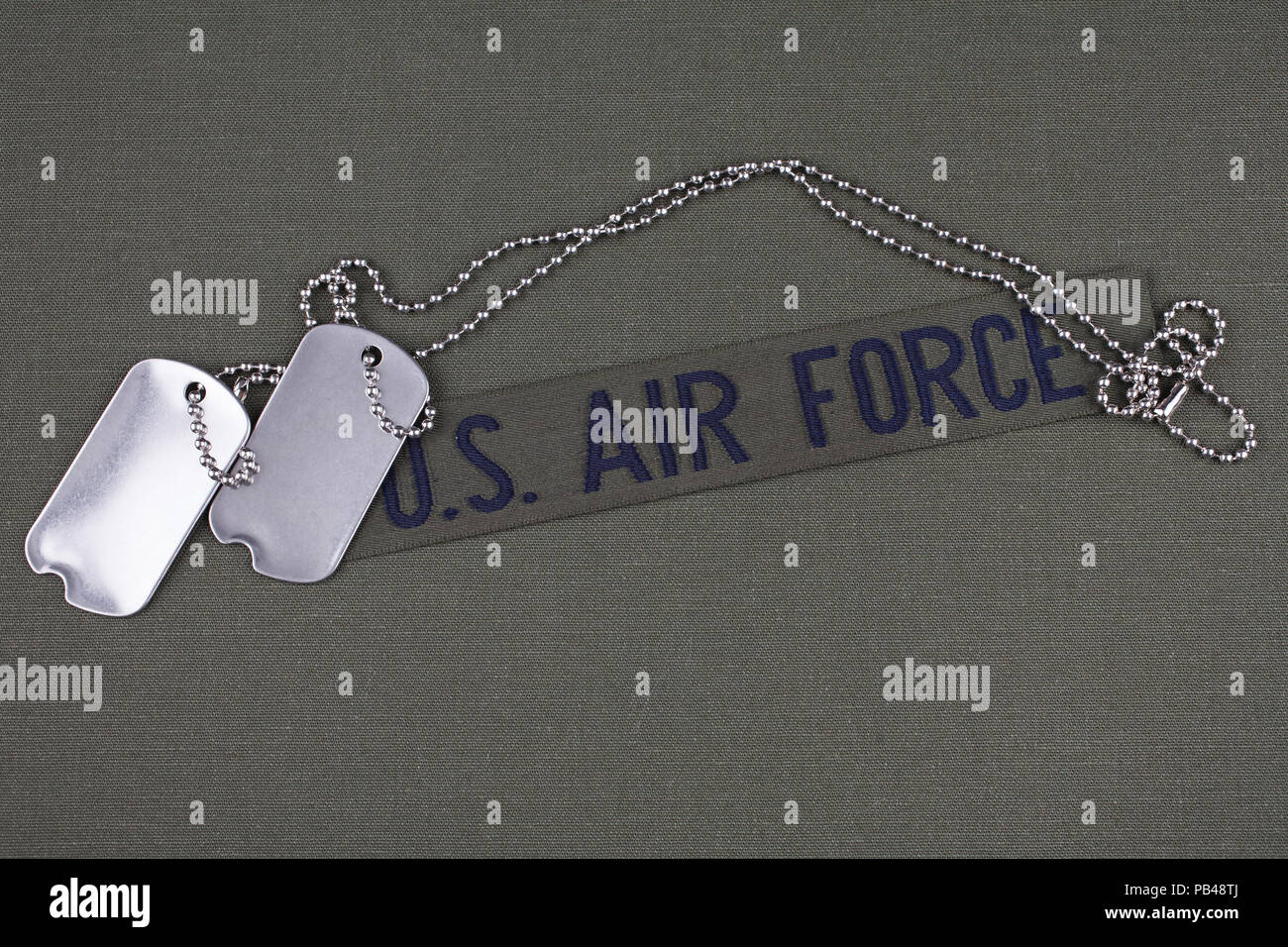 U.S. AIR FORCE Branch Tape with dog tags on olive green uniform ...