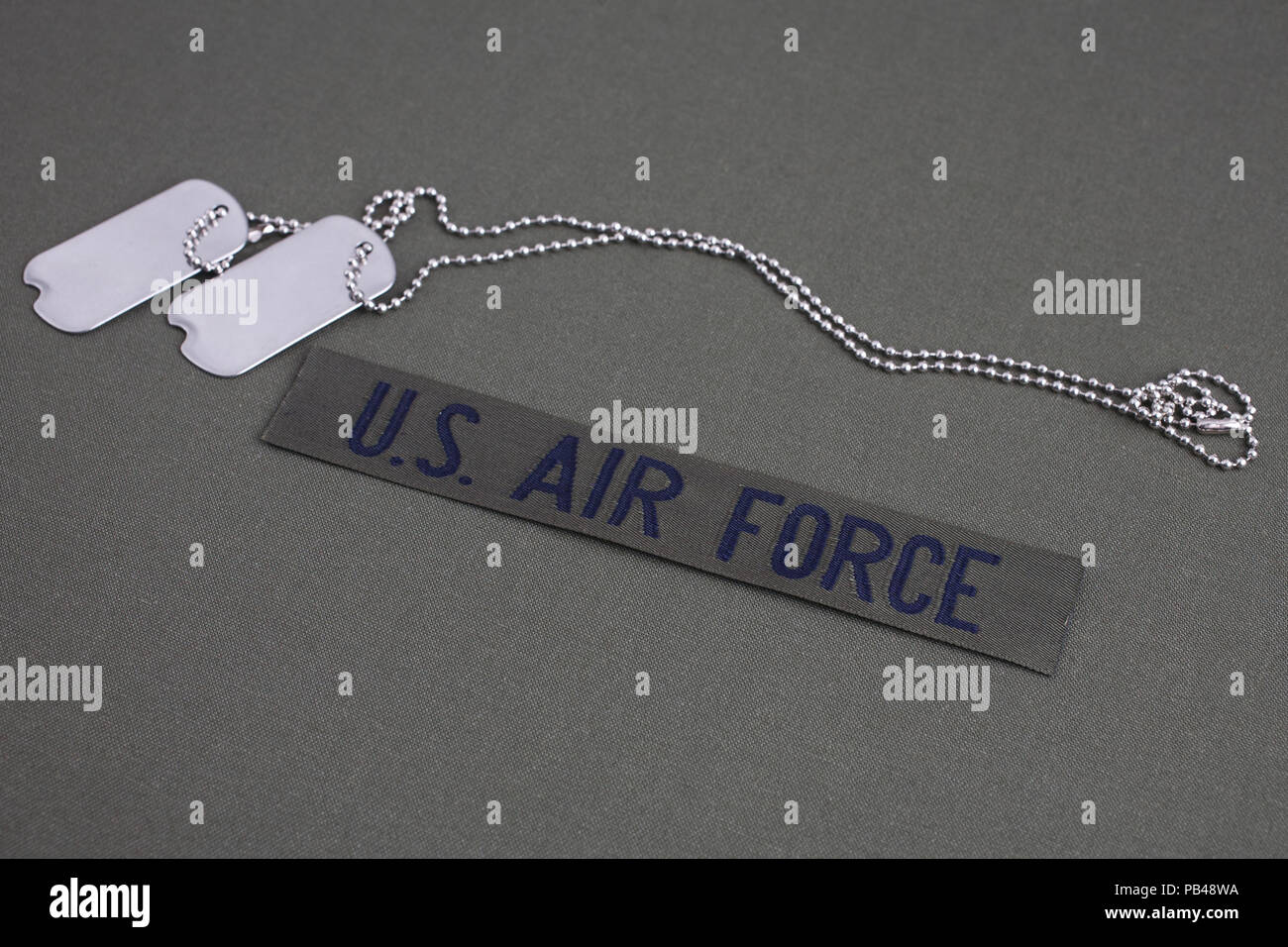 U.S. AIR FORCE Branch Tape with dog tags on olive green uniform ...