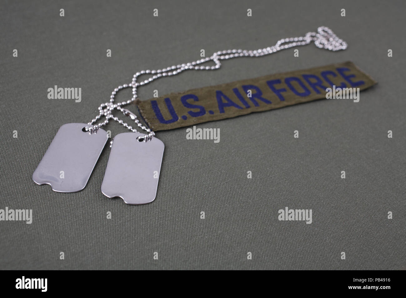 U.S. AIR FORCE Branch Tape with dog tags on olive green uniform ...