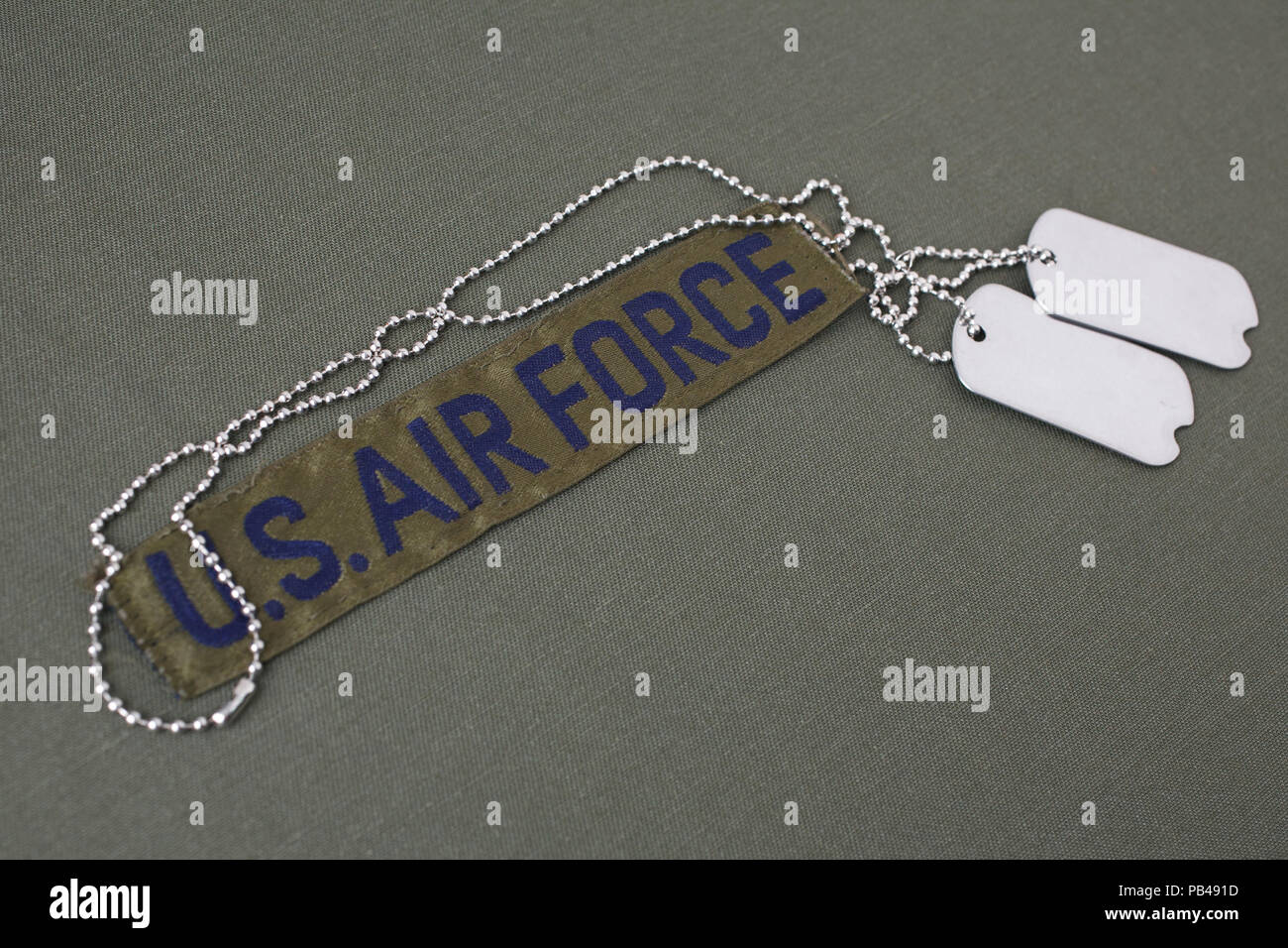 U.S. AIR FORCE Branch Tape with dog tags on olive green uniform ...