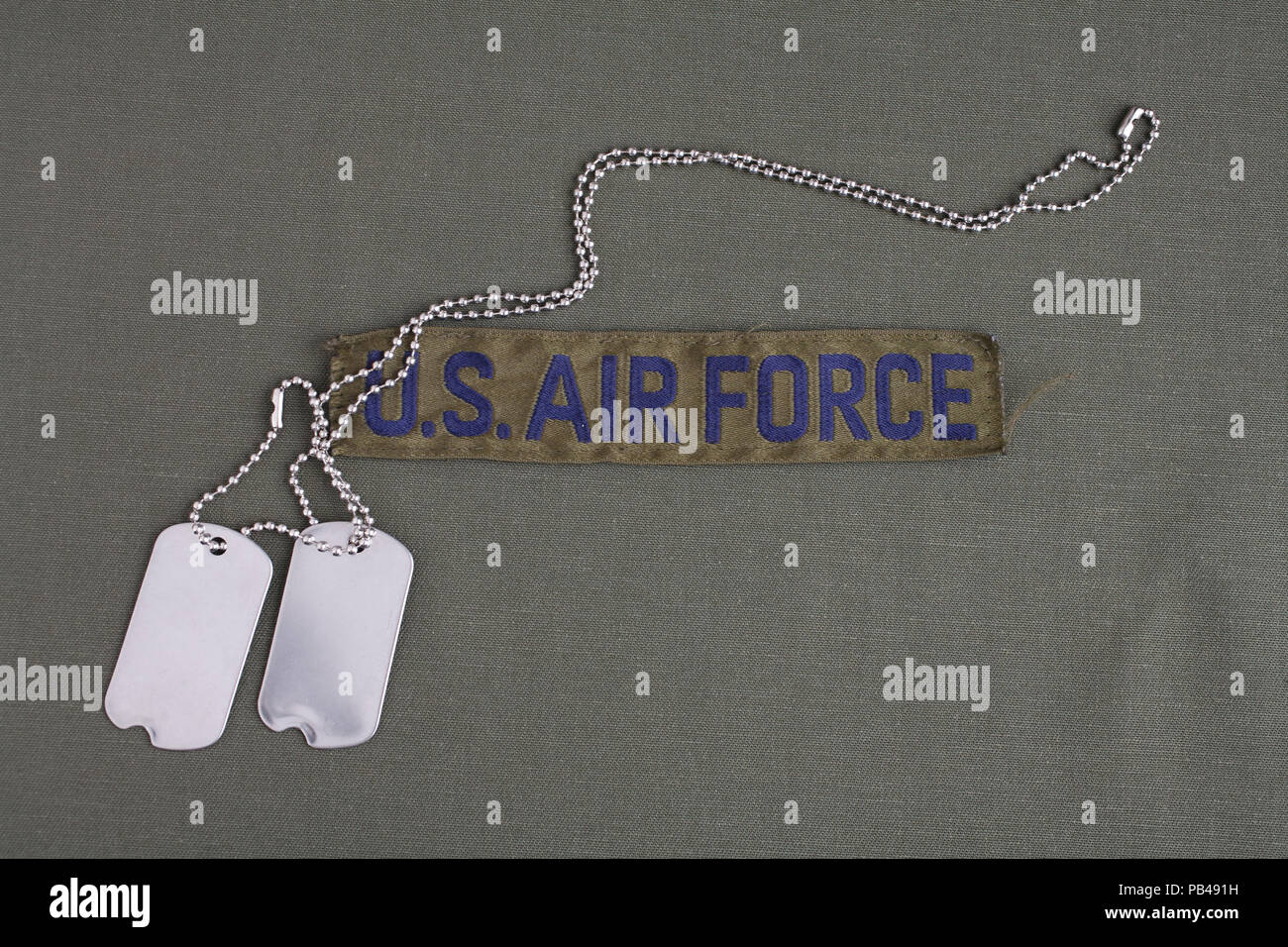 U.S. AIR FORCE Branch Tape with dog tags on olive green uniform ...