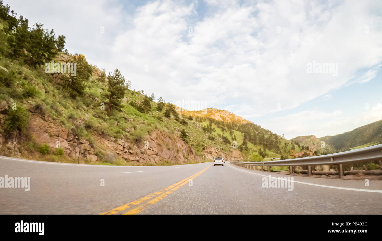 Driving on mountain road between Estes Park and Boulder in evening ...