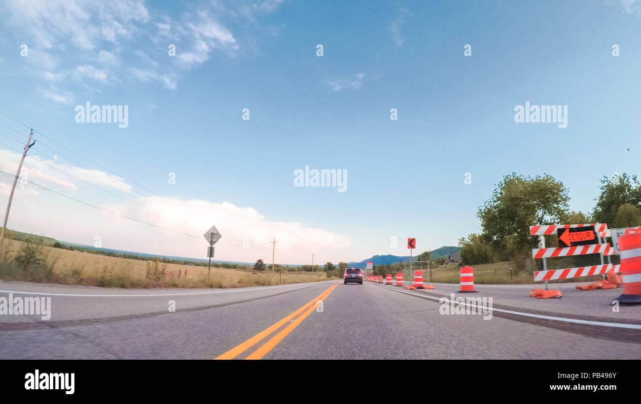 Driving on paved road with shoulder construction zone Stock Photo - Alamy