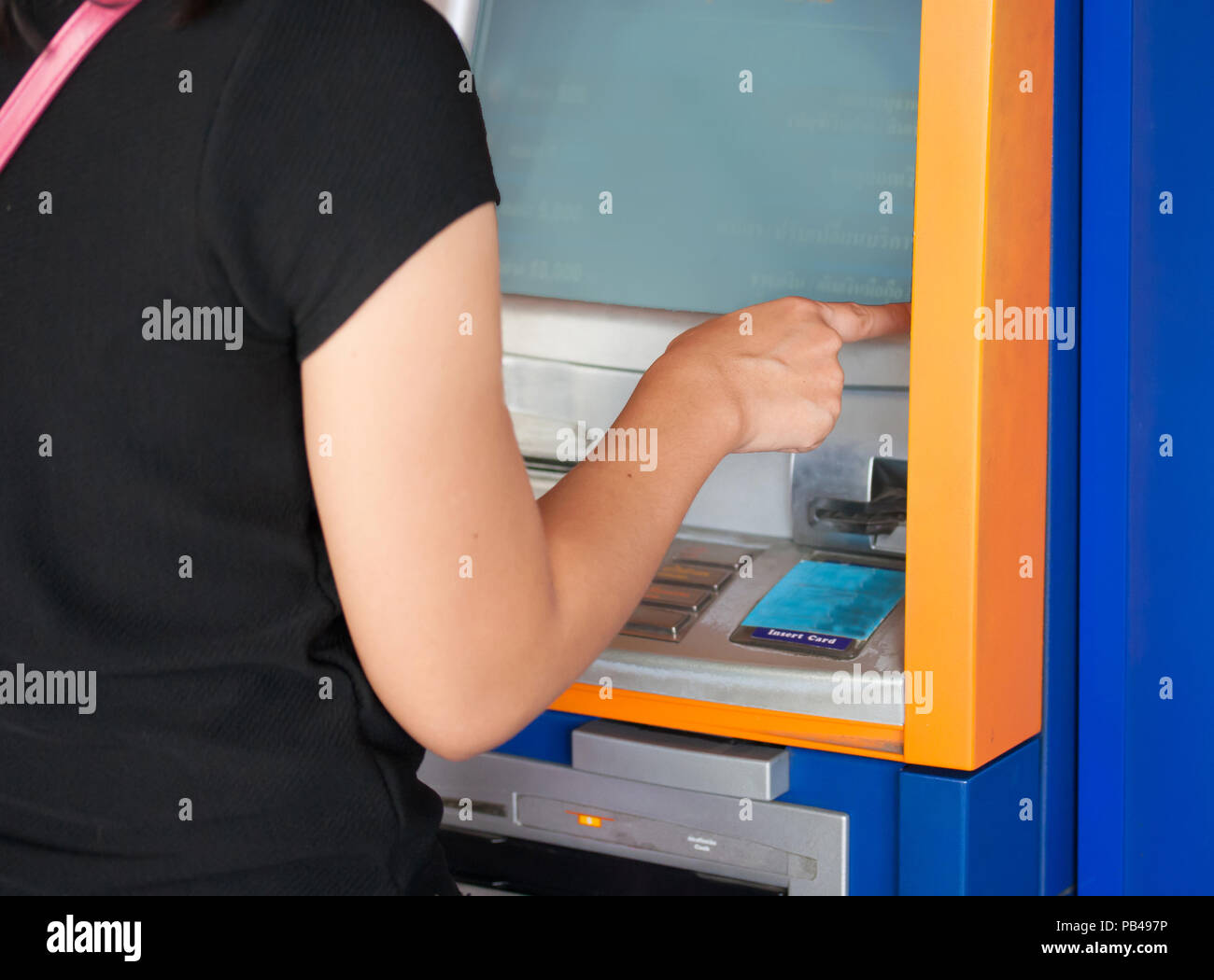 pressing password number on ATM machine Stock Photo - Alamy