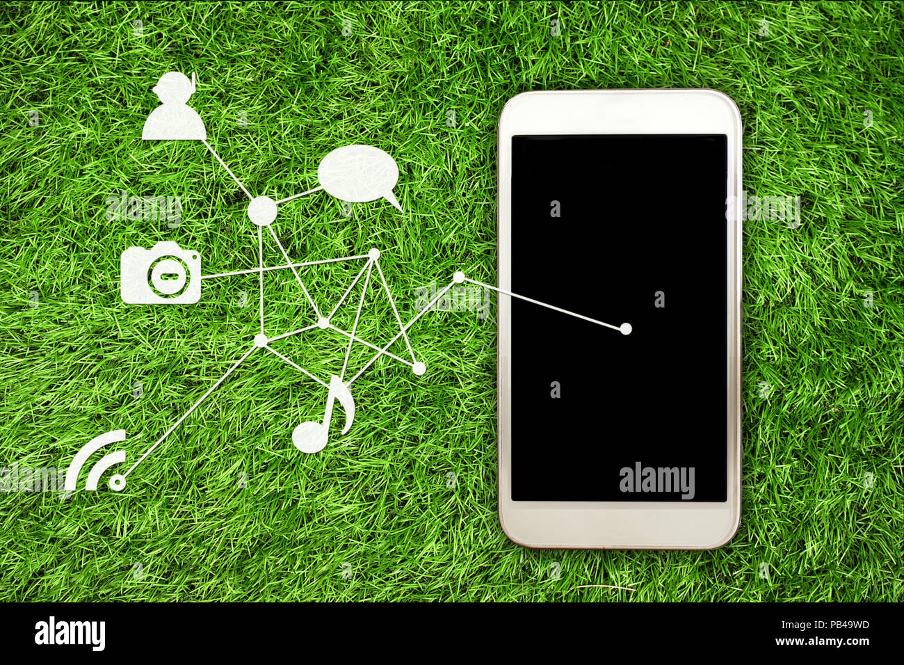 smartphone on grass background Stock Photo - Alamy