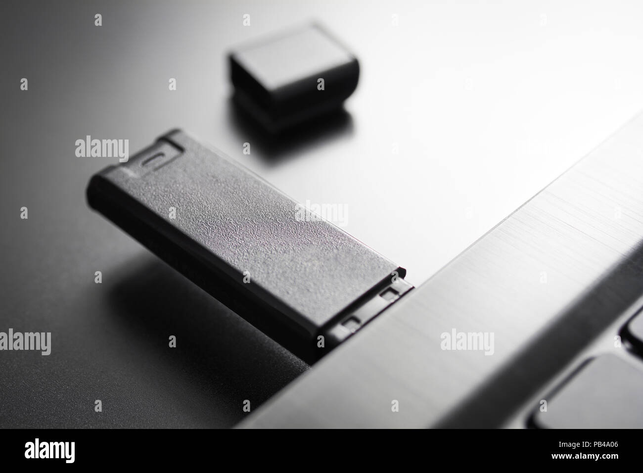 Close-Up Of A Black USB Memory Stick Plugged Into The USB Port Of A ...