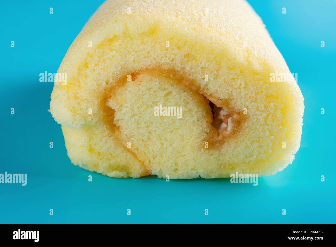 the cross section of a healthy sponge cake on a blue background Stock ...