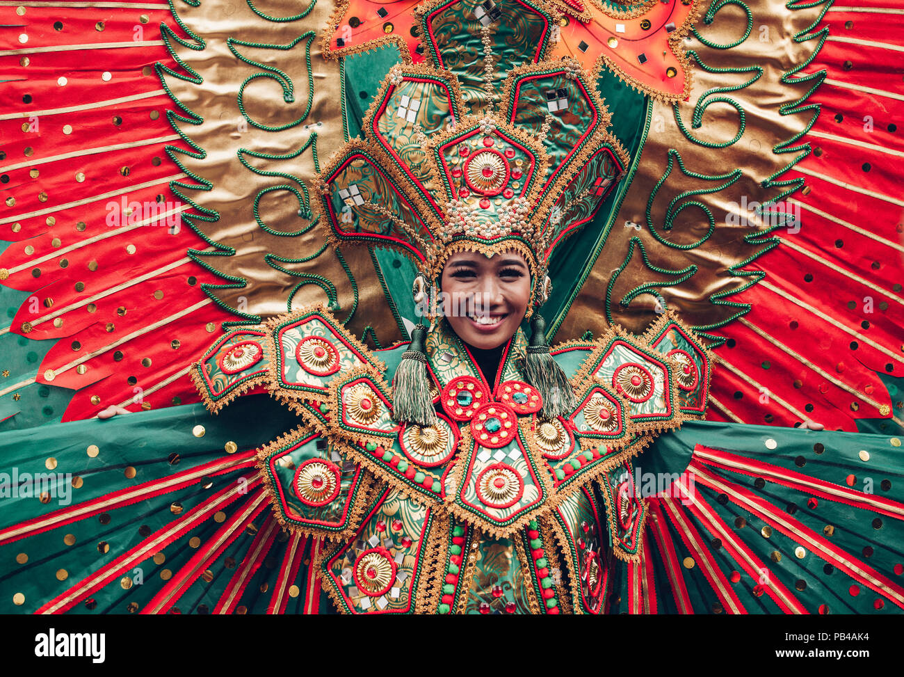 Woman in traditional Indonesian costume of Garuda during ritual dance ...