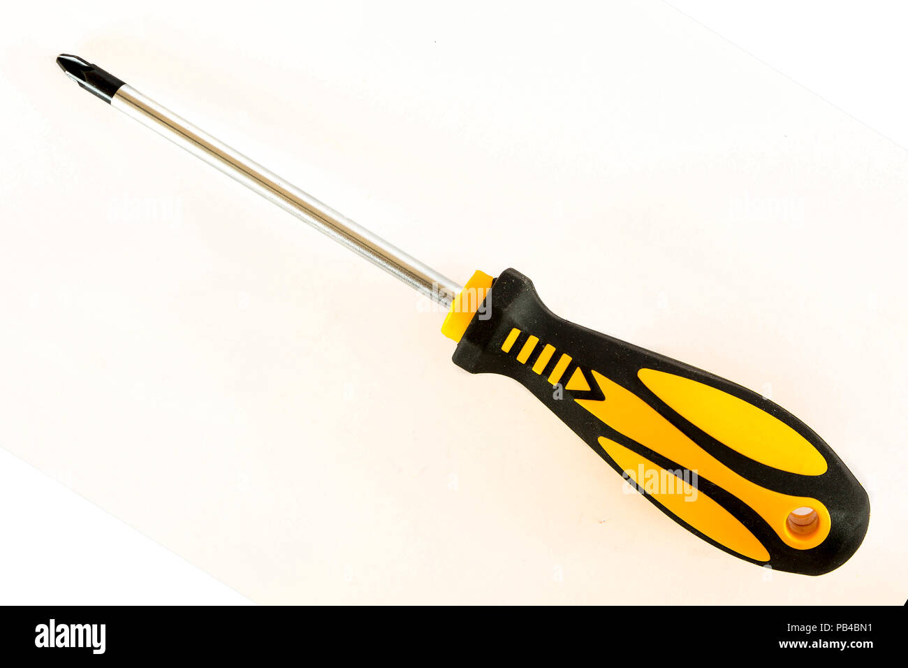Screwdriver with rubber black and yellow handles isolated on a white ...