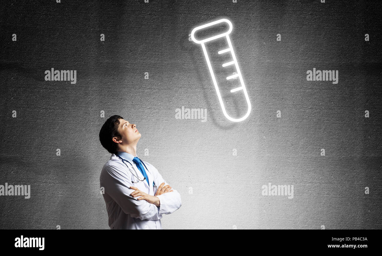 Doctor and vial symbol Stock Photo - Alamy