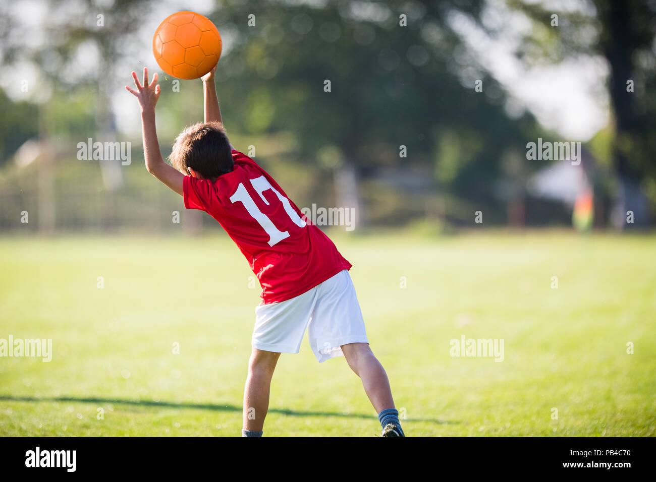 Boy throws grass hi-res stock photography and images - Alamy