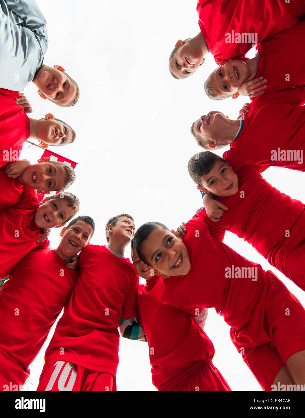 Kids soccer football team in huddle Stock Photo - Alamy