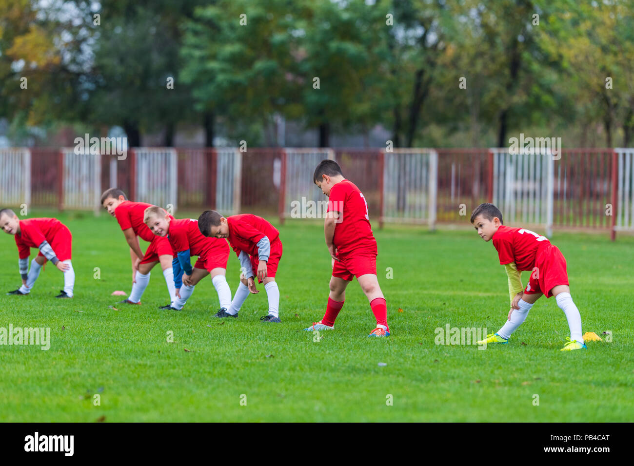 Children's soccer team in the field exercise Stock Photo - Alamy