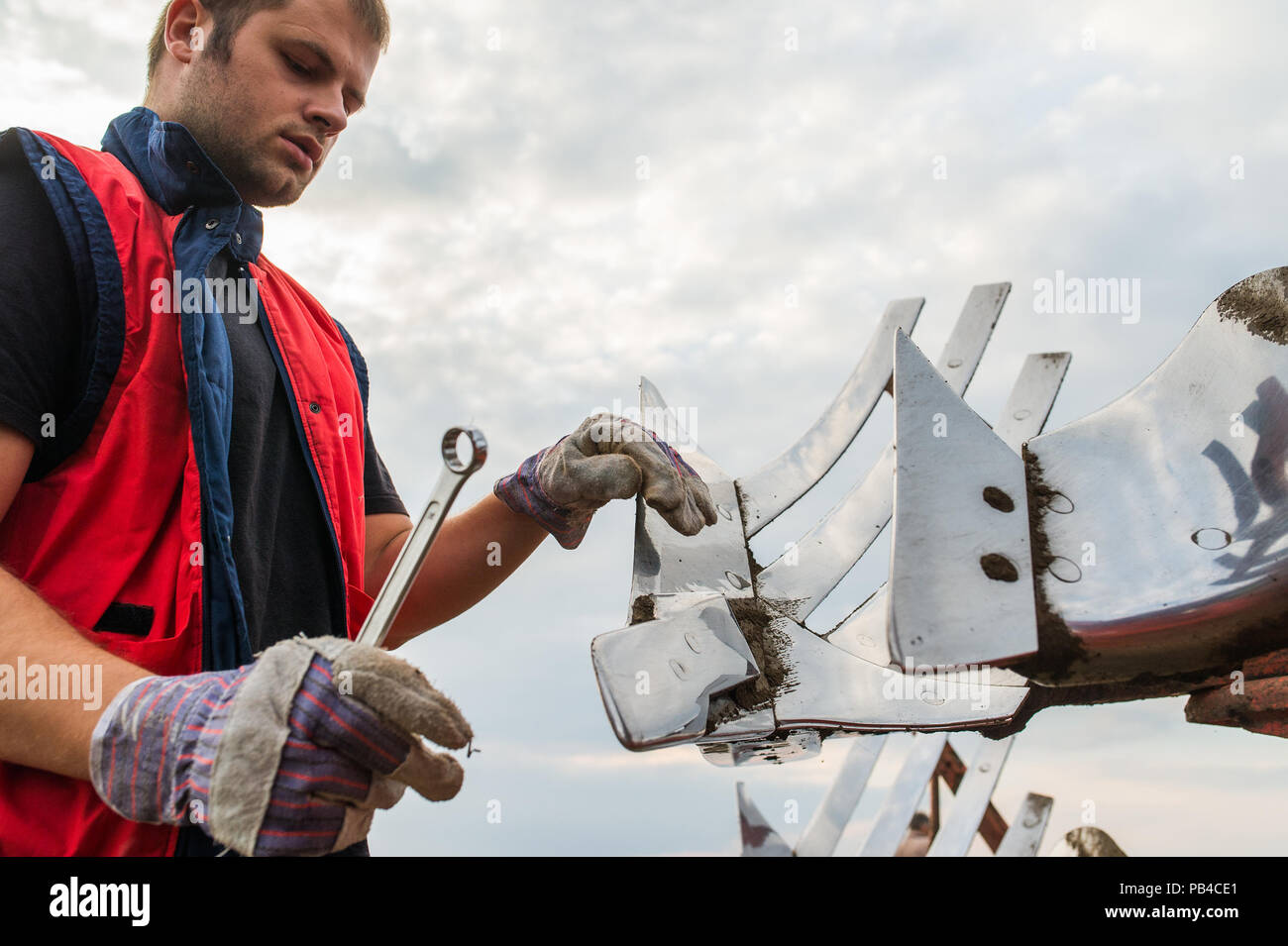 Mechanic repairing tractor hi-res stock photography and images - Alamy