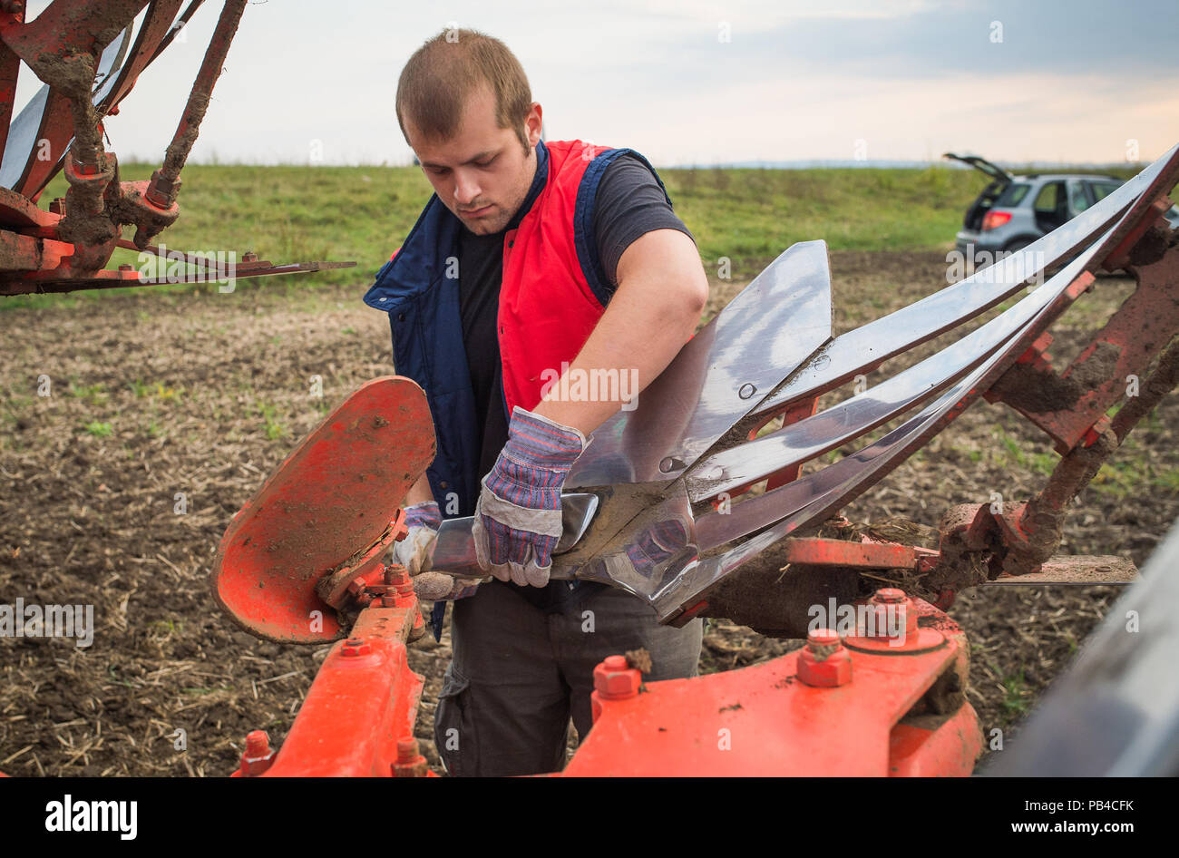 Mechanic repairing tractor hi-res stock photography and images - Alamy