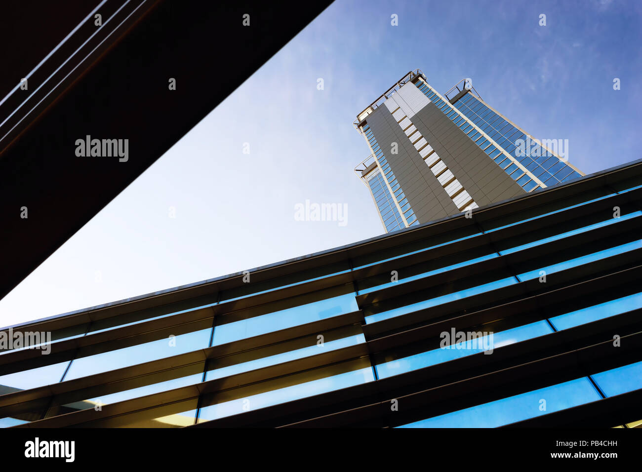 Modern building from glass and concrete with the geometry of lines and ...