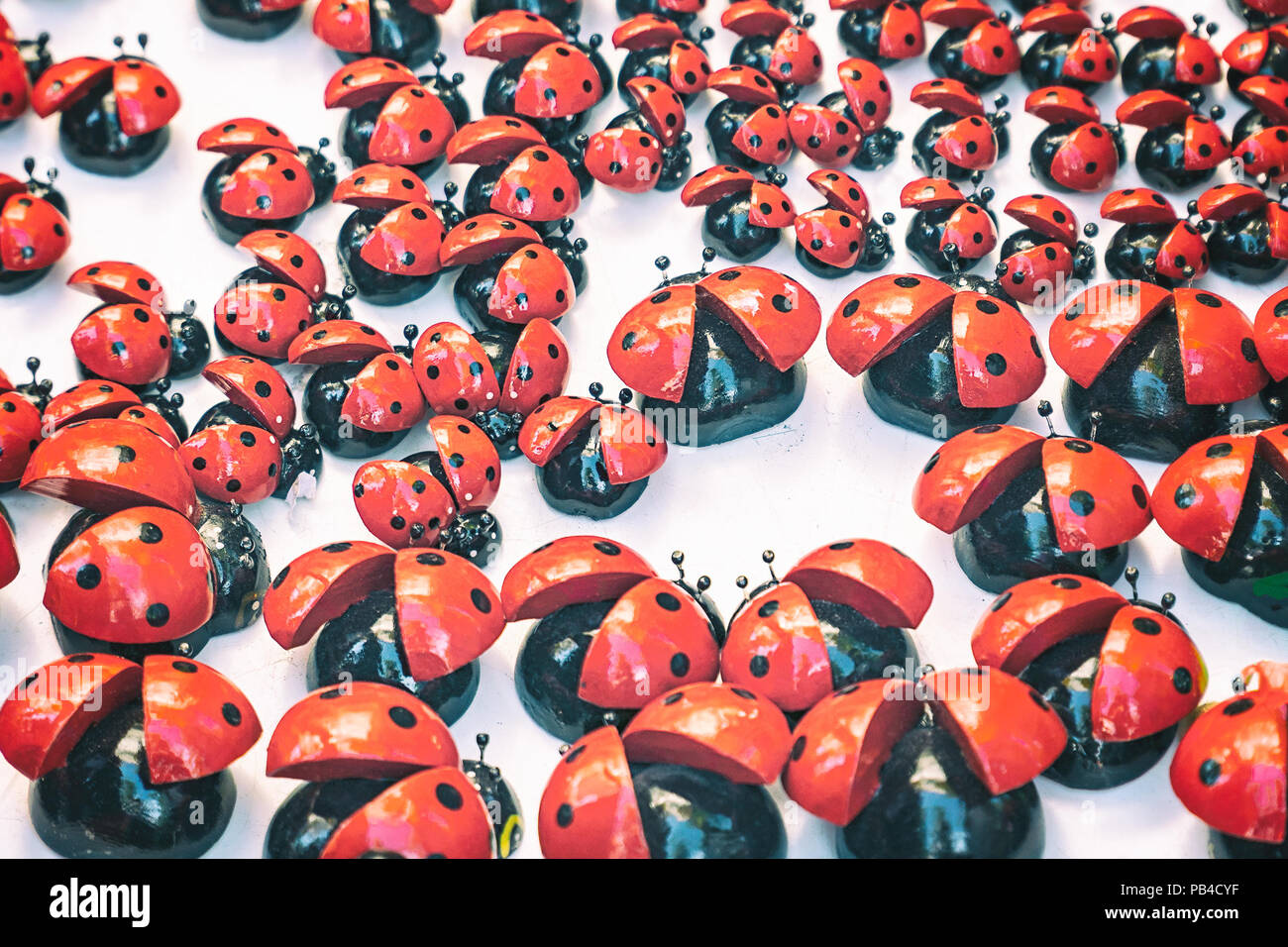Many artificial lady bug toy Stock Photo - Alamy