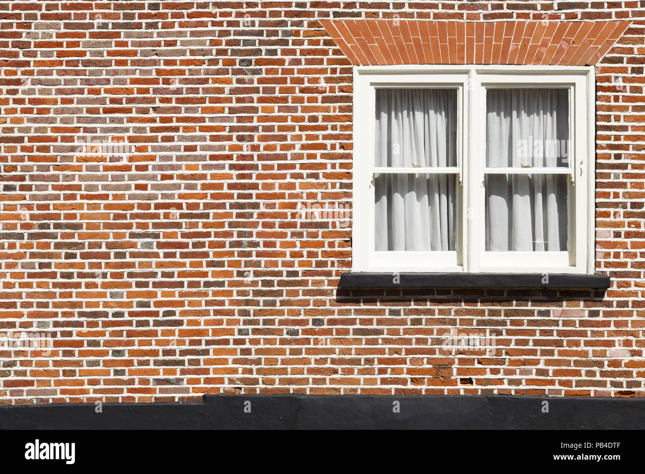 Traditional sash window and red brick wall background with copyspace ...