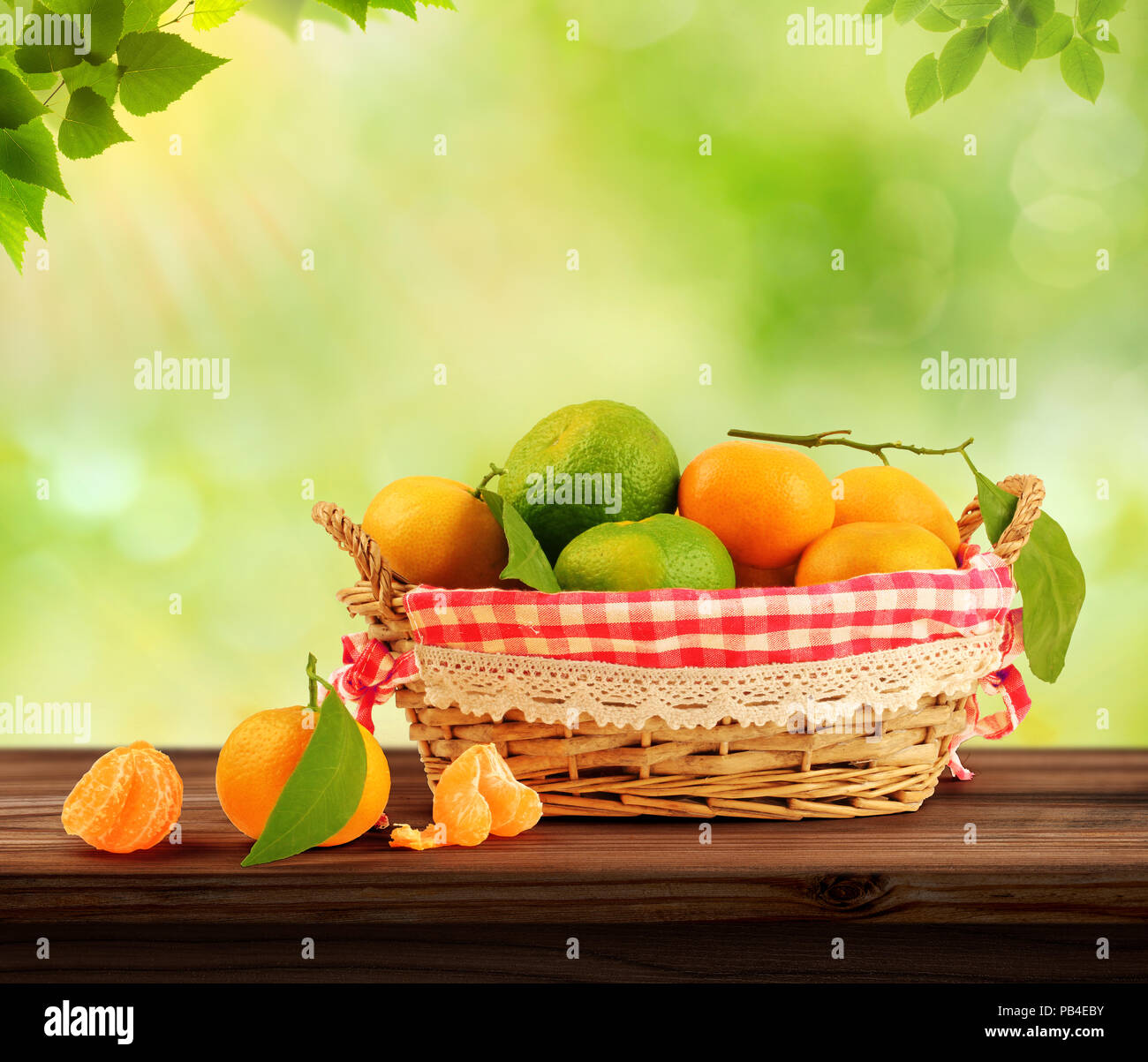 Tangerine inside basket with clipping path Stock Photo - Alamy