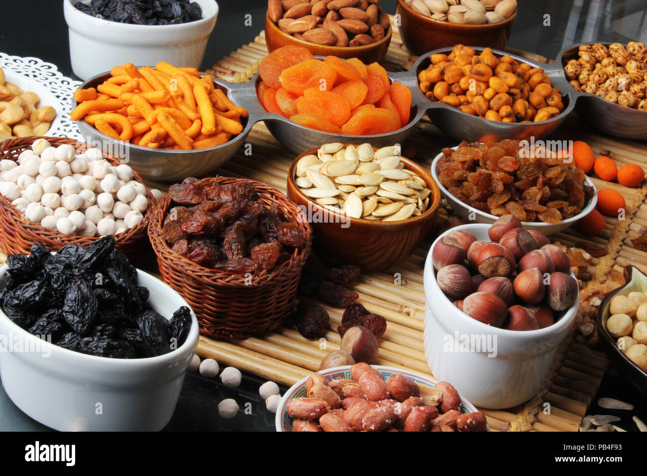 Nuts family on dark background Stock Photo - Alamy