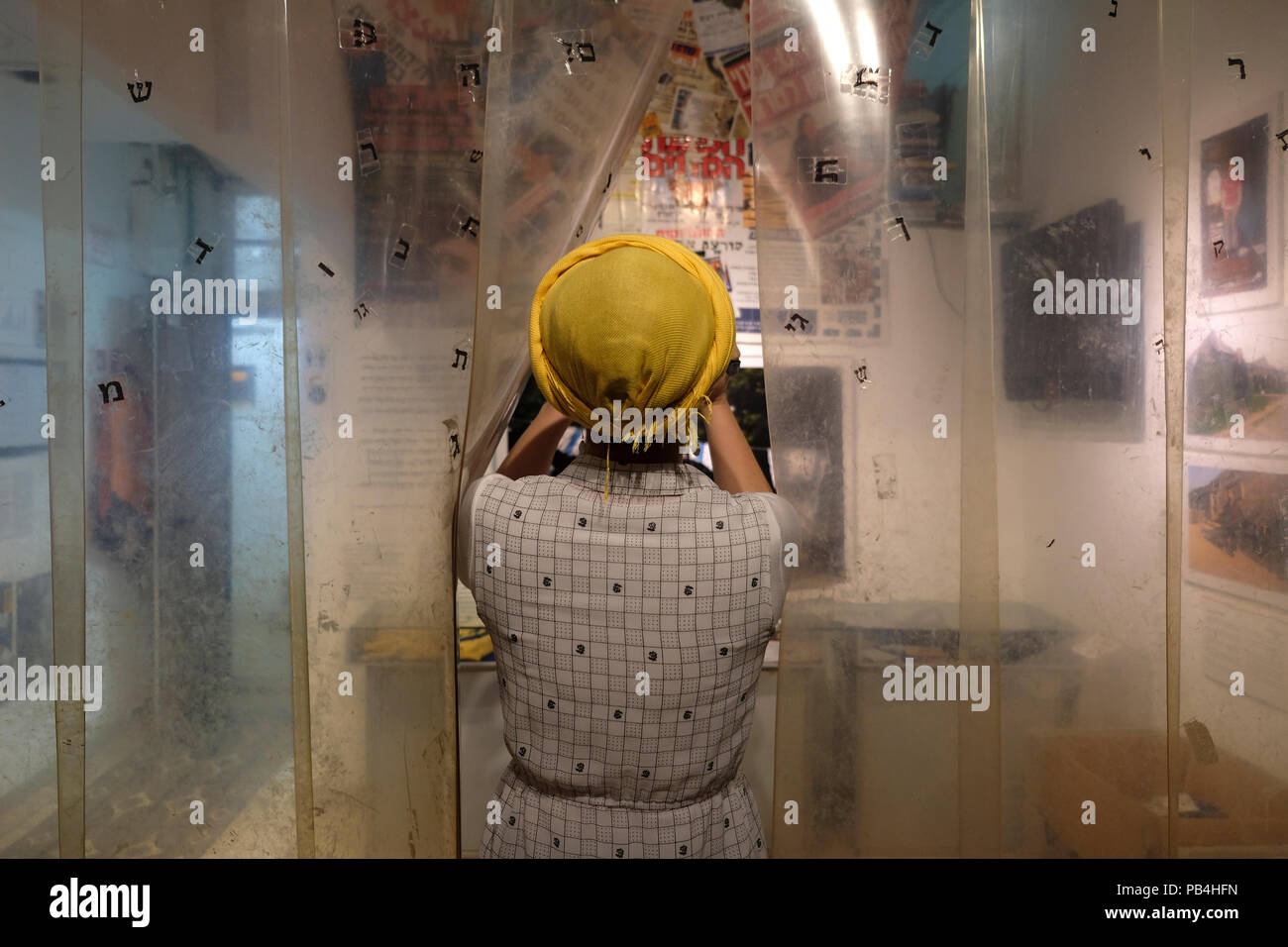 A religious Jewish woman taking photographs inside the Gush Katif ...
