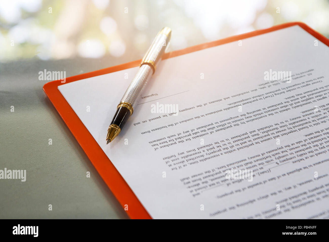 A pen on contract paper preparation for signing a contract Stock Photo ...