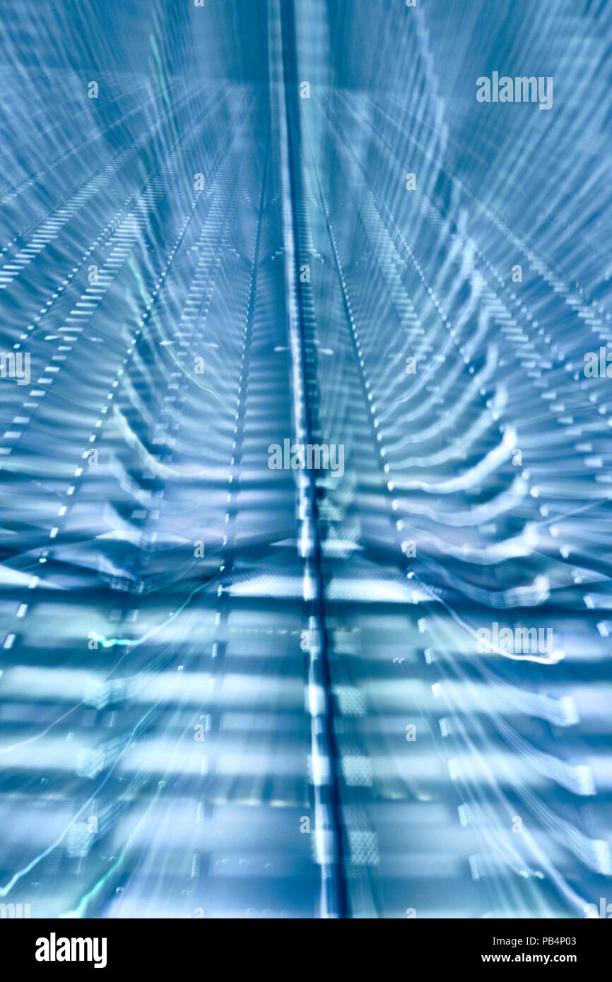 Abstract blue futuristic background made by zooming a camera pointed at ...