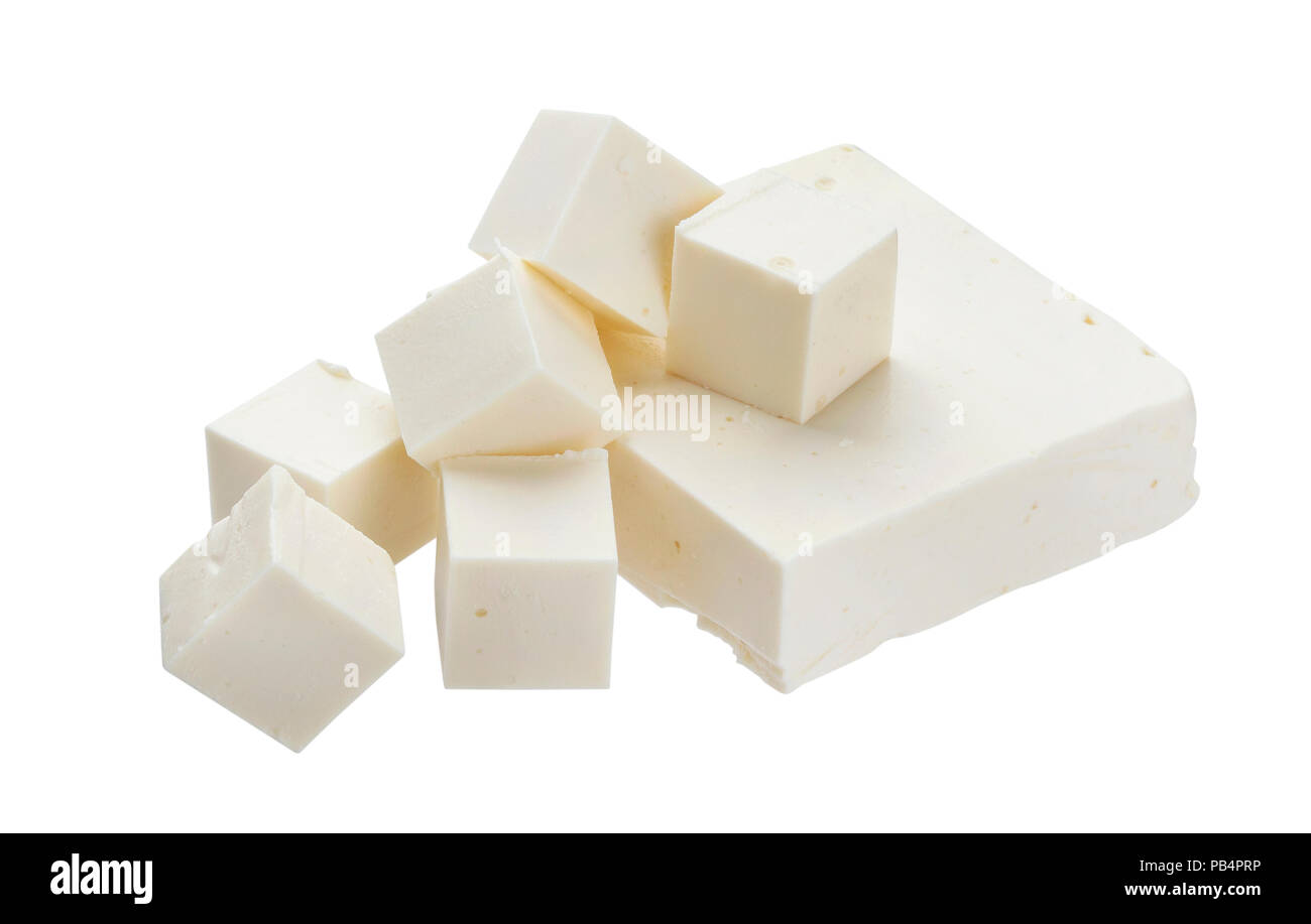 Heap of diced feta cubes isolated on white background Stock Photo - Alamy
