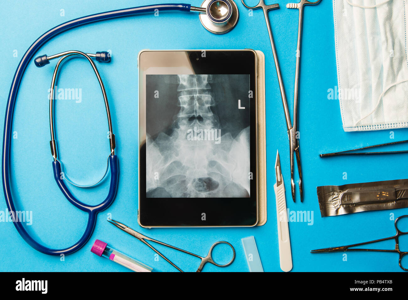 Surgical tool on blue table Stock Photo - Alamy