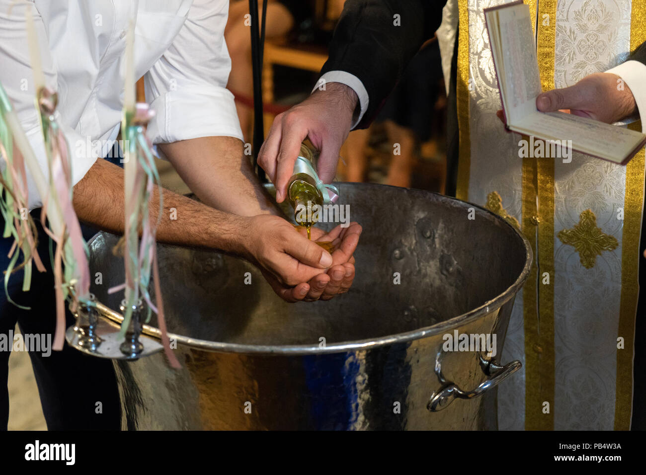 Infant baptism oil hi-res stock photography and images - Alamy