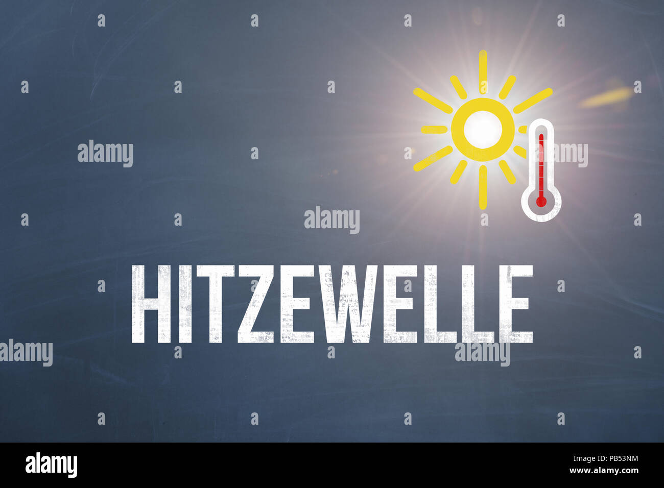 Extreme heat wave written in german with sun and thermometer during the ...