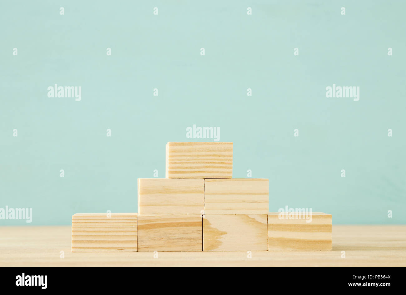 wood blocks stacking as step stairs. success and development concept ...