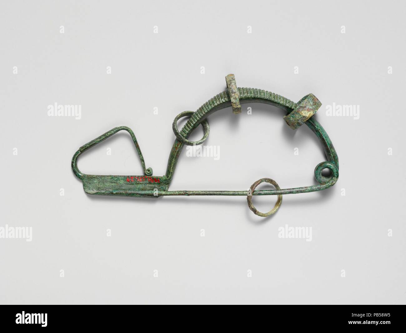 Bronze fibula (safety pin) with four rings. Culture: Italic. Dimensions ...