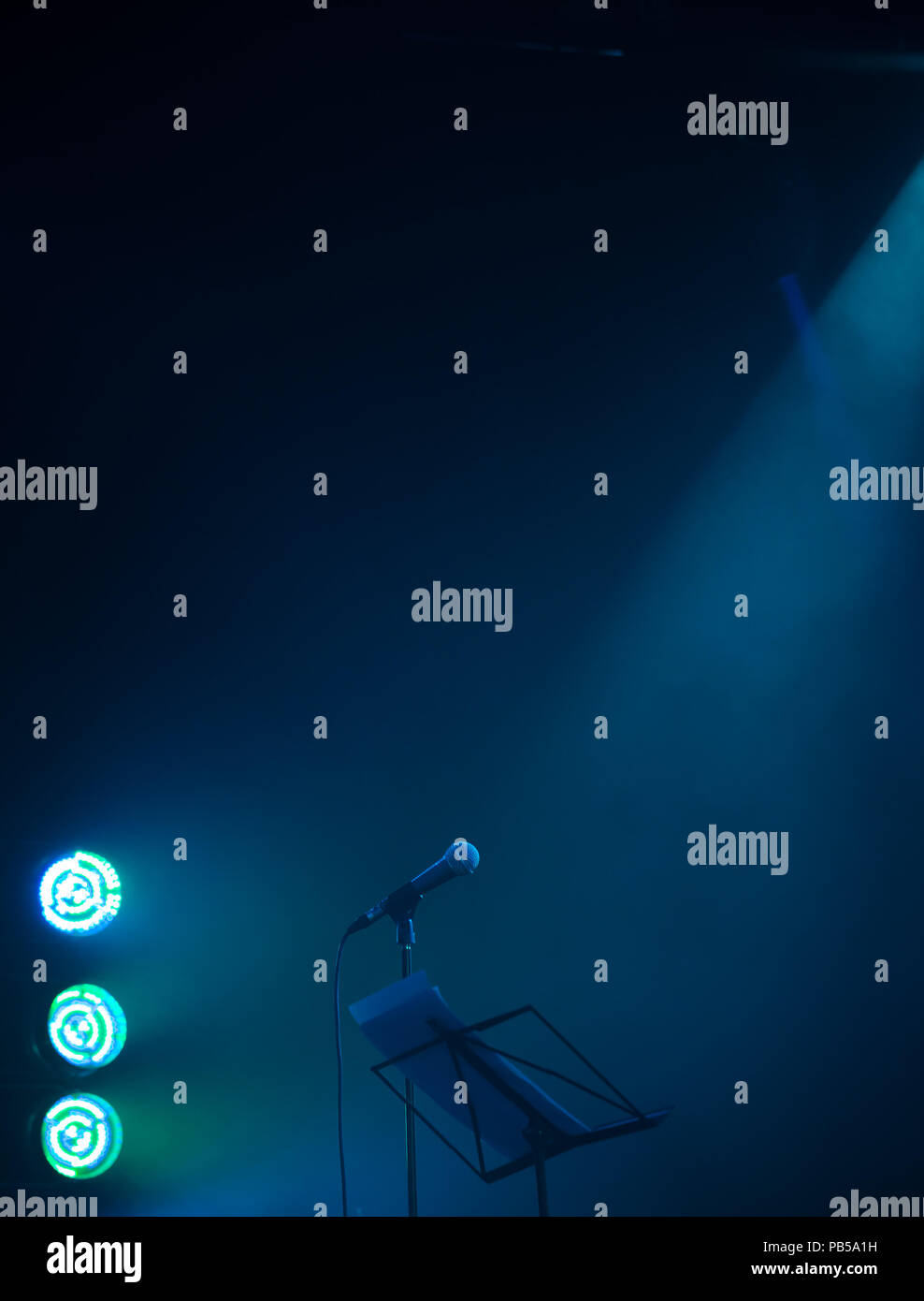 Empty music stage background photo with microphone and blurred blue ...