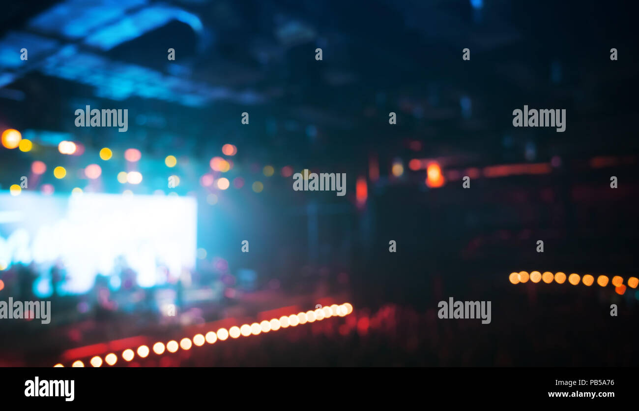 Blurred photo background, music concert stage with colorful ...