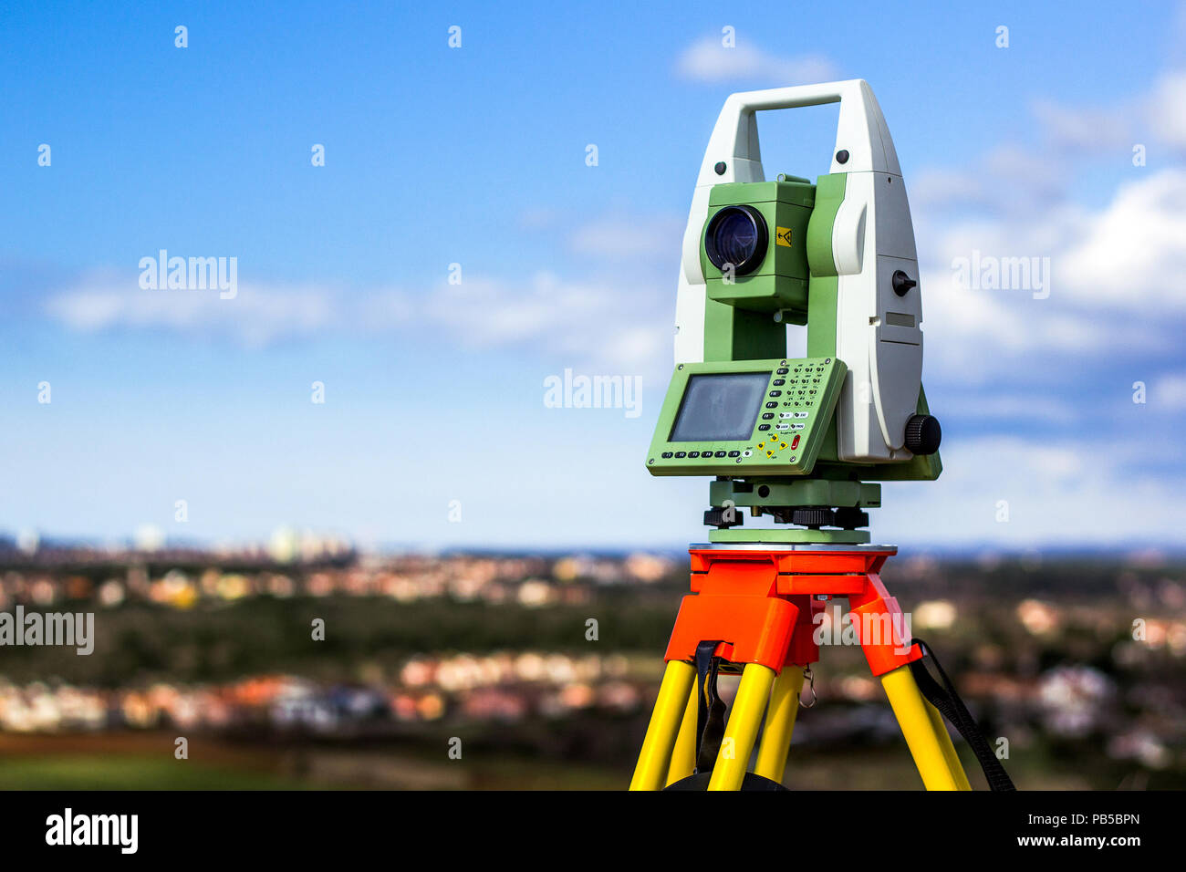 Fall time land surveying, total station set in the field Stock Photo ...